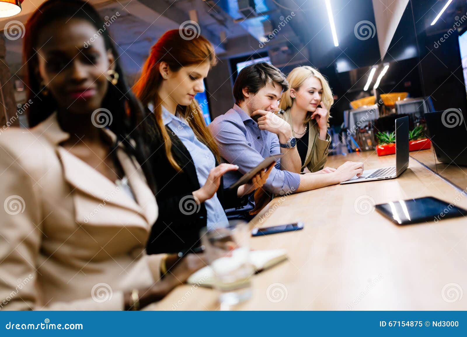 Coworkers bonding in pub stock image. Image of adult - 67154875