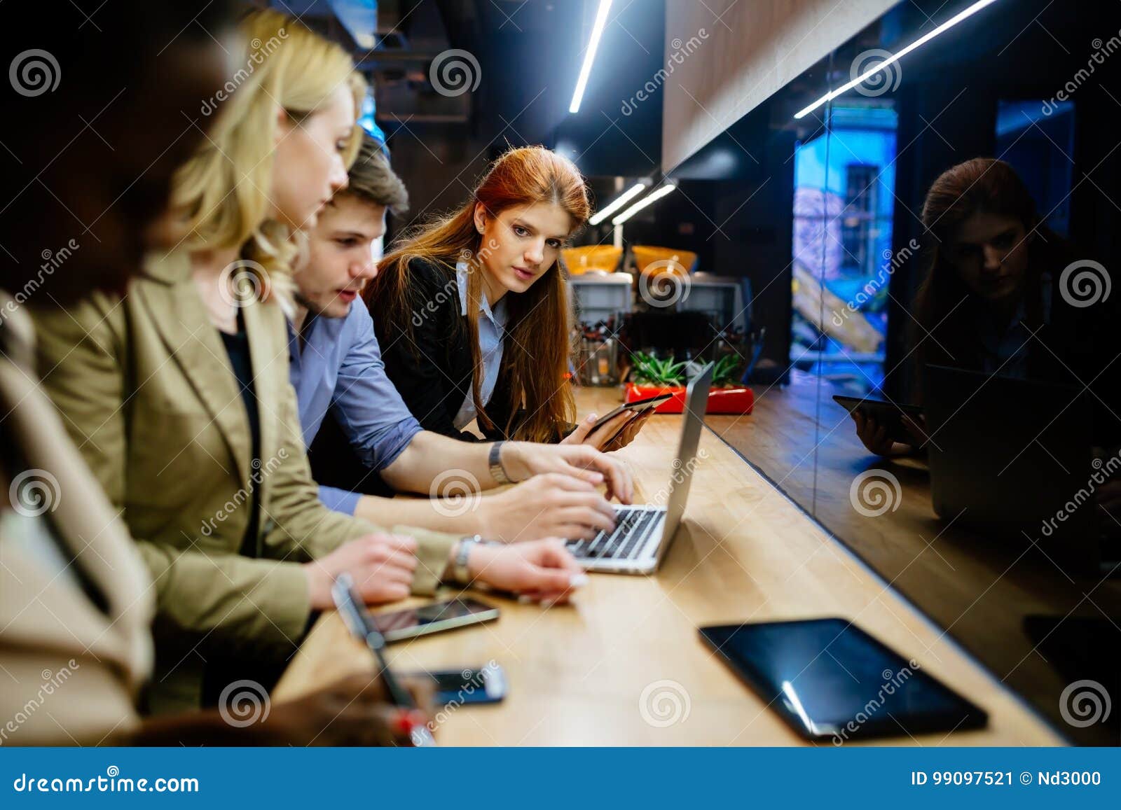 Coworkers bonding in pub stock image. Image of glass - 99097521