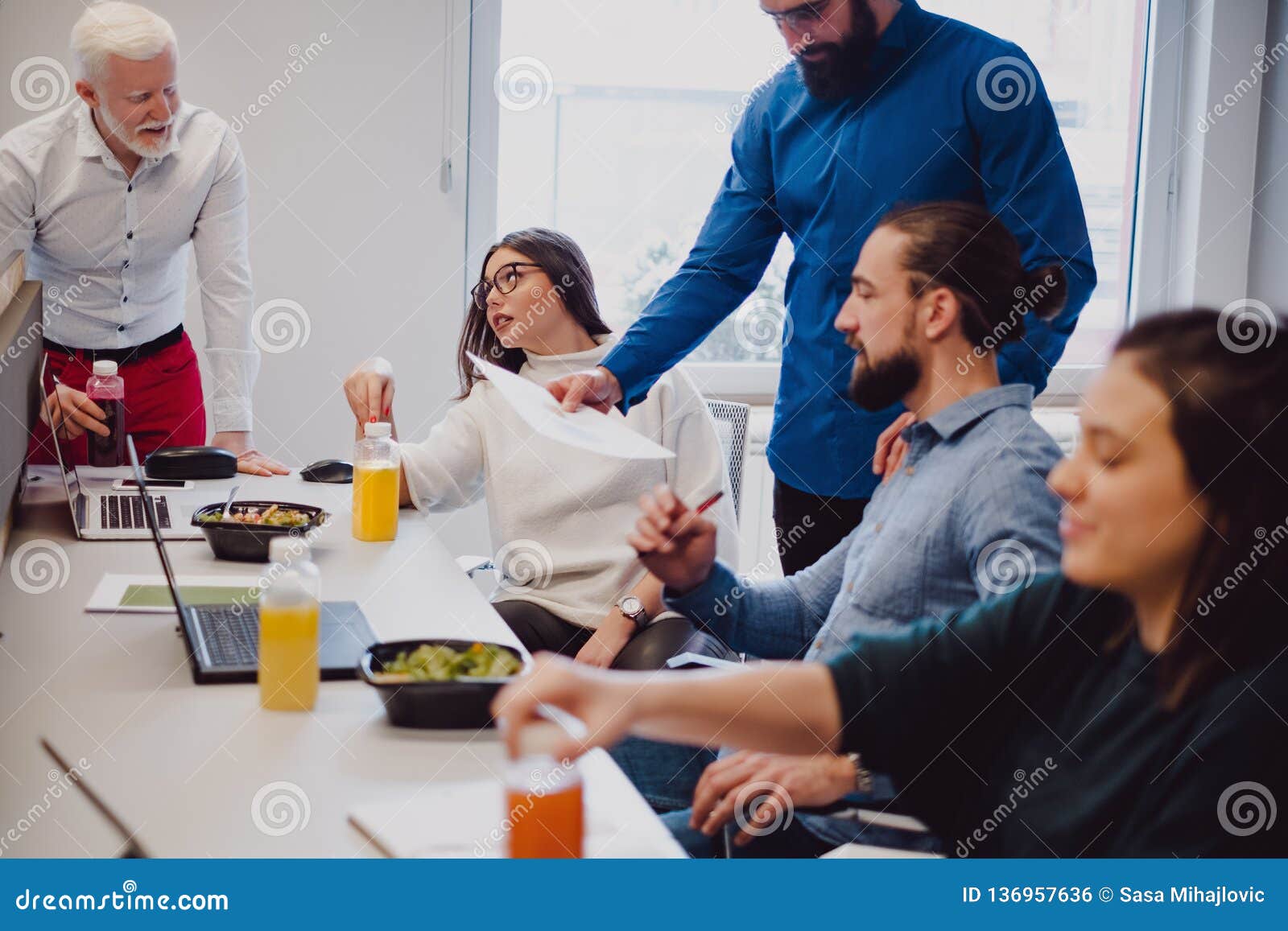 Coworkers Discussing and Having Lunch in the Office Stock Photo - Image ...