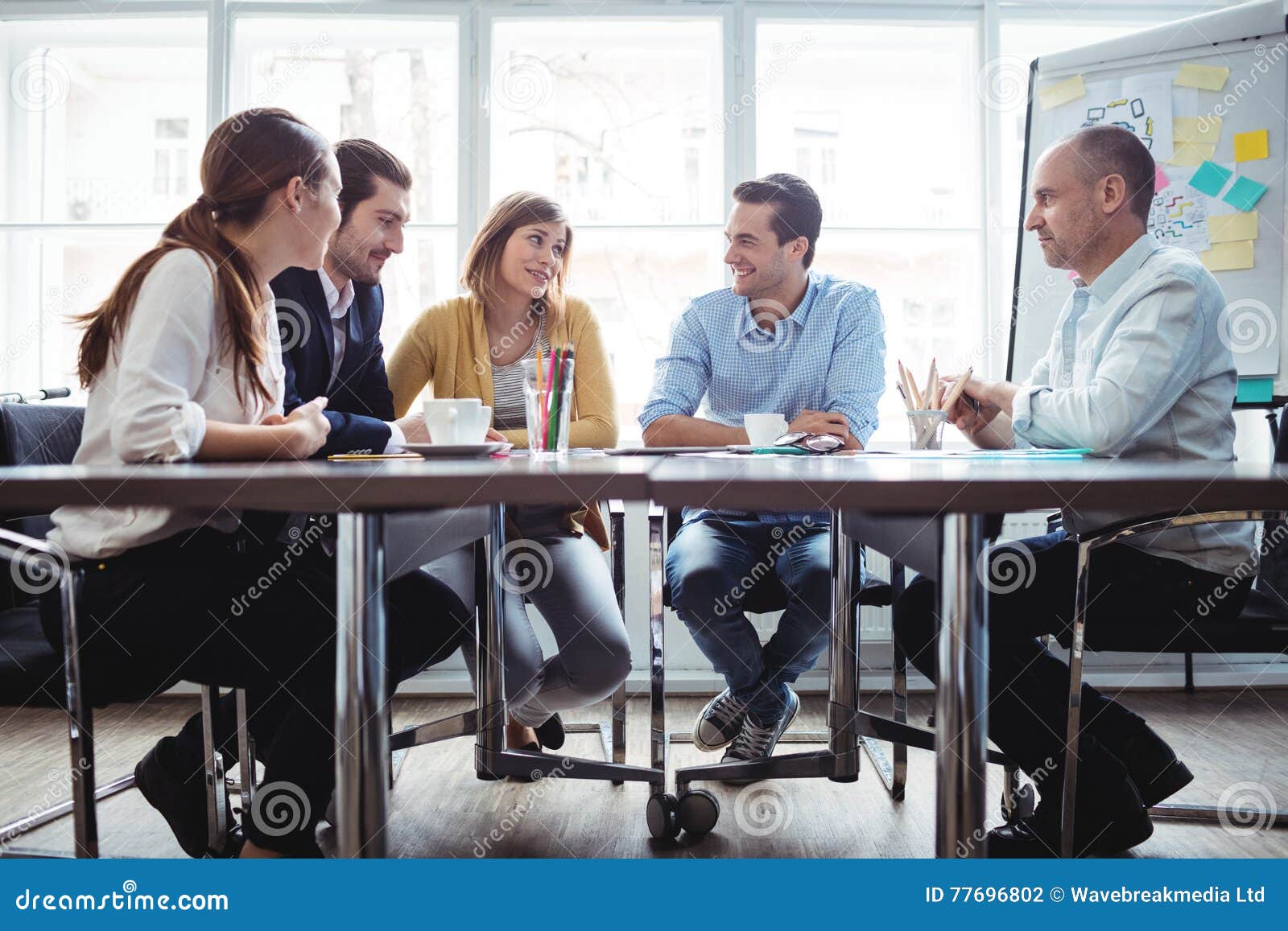 Coworkers Discussing in Meeting Room Stock Photo - Image of colleagues ...