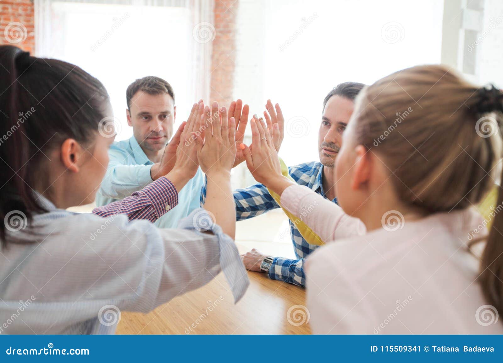 Coworkers doing high five stock image. Image of creative - 115509341