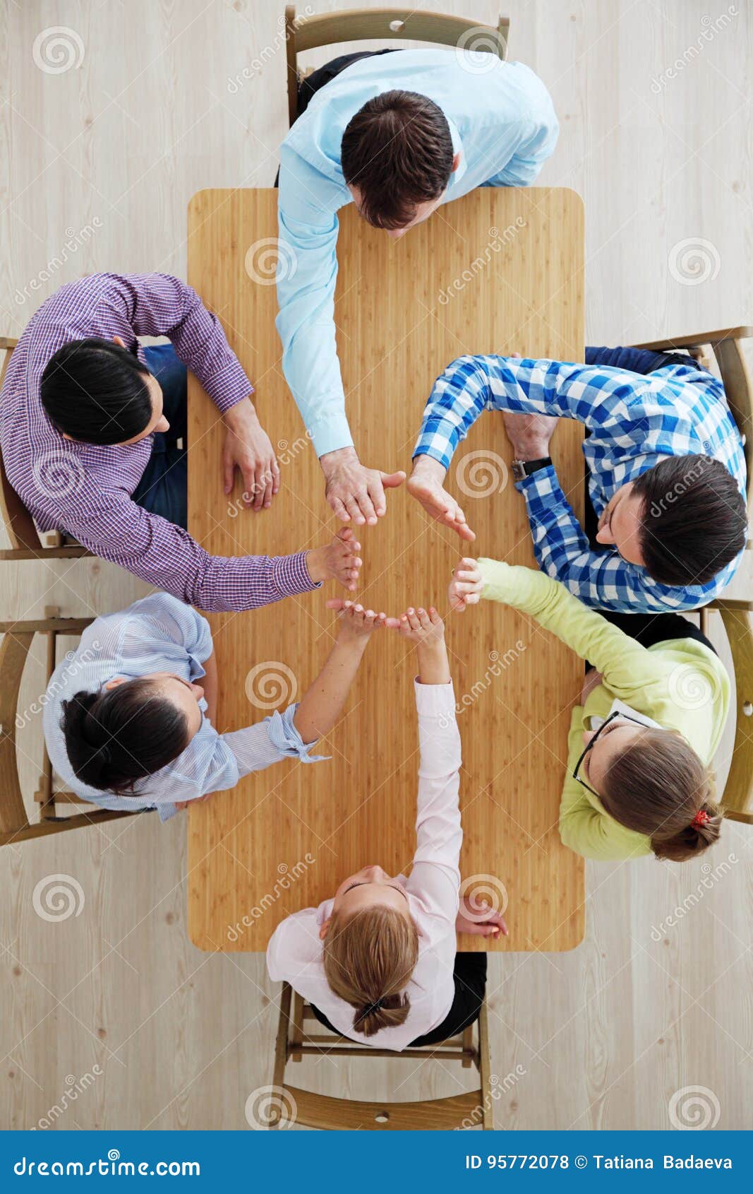 Coworkers doing high five stock photo. Image of success - 95772078