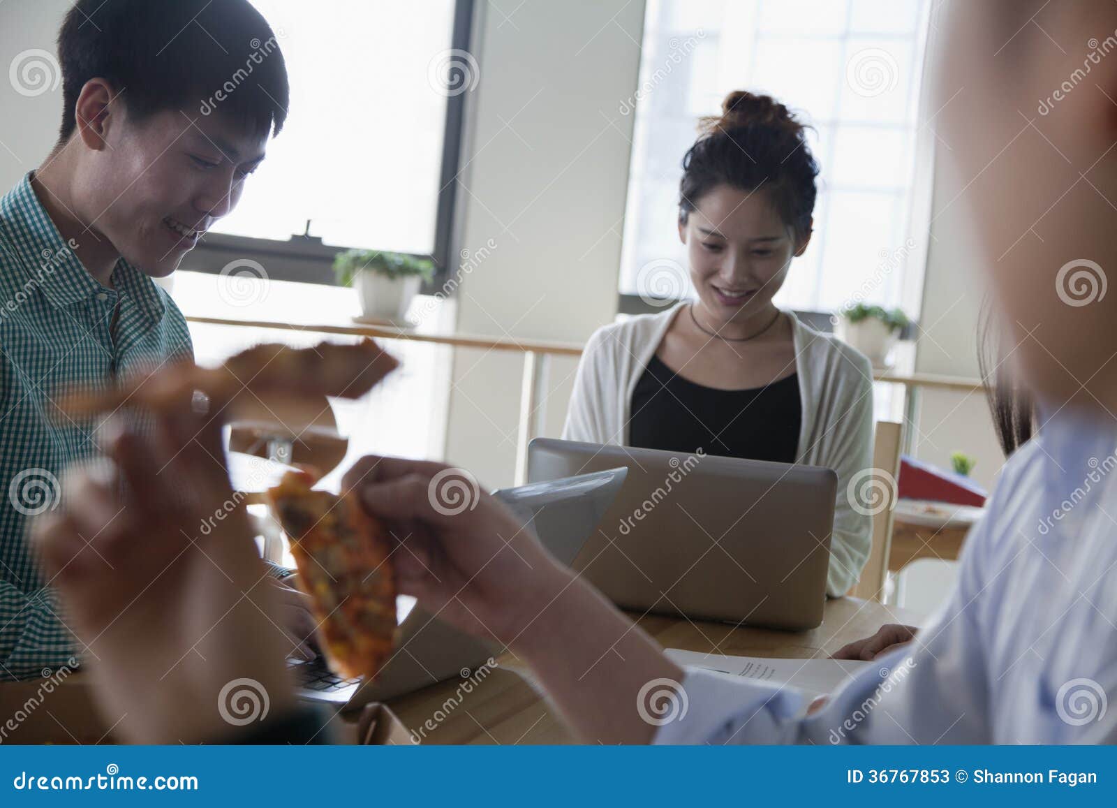 Coworkers Eating and Working in the Cafeteria Stock Image - Image of ...
