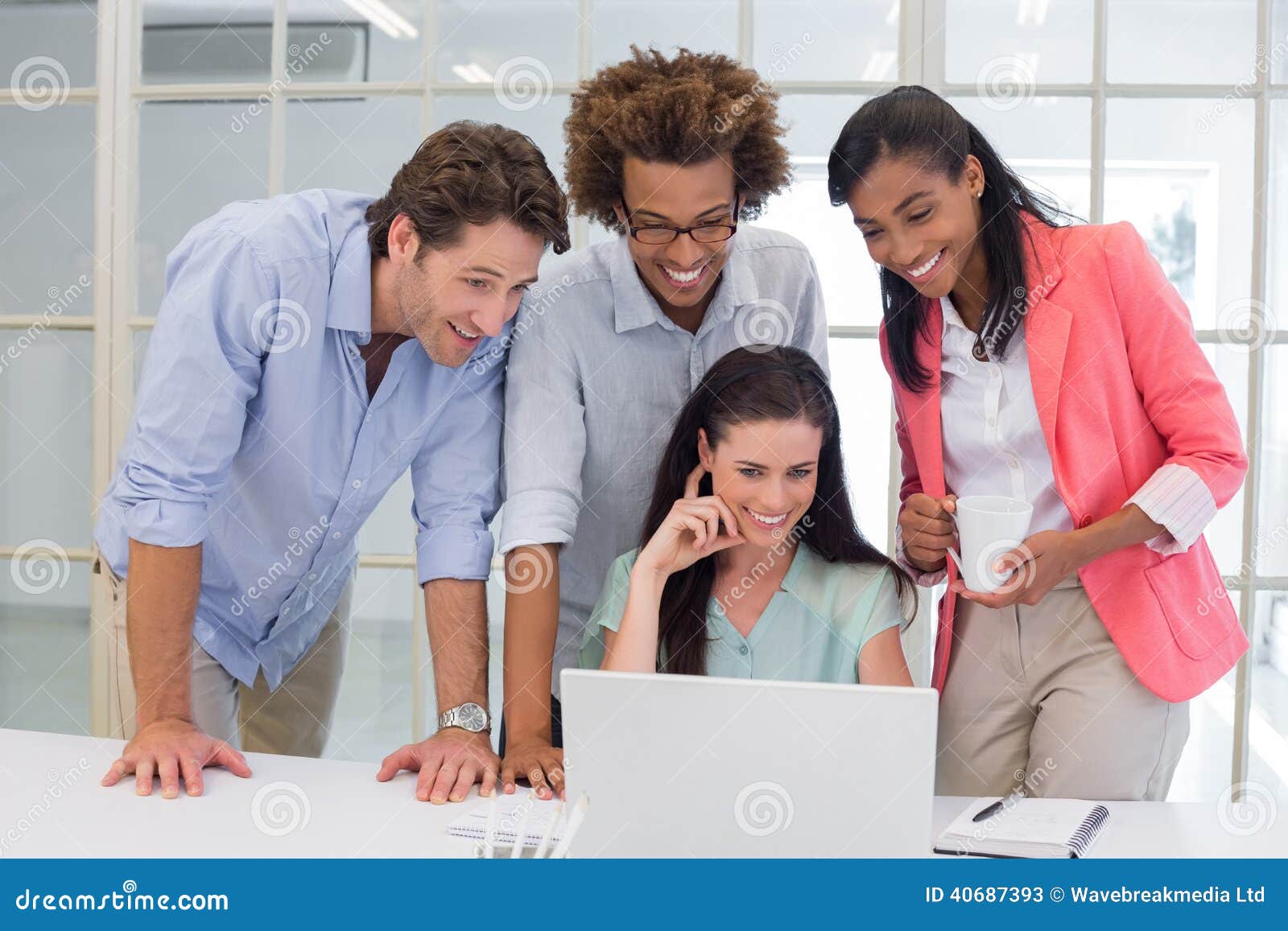 Coworkers Interacting with Laptop Computer Stock Image - Image of ...
