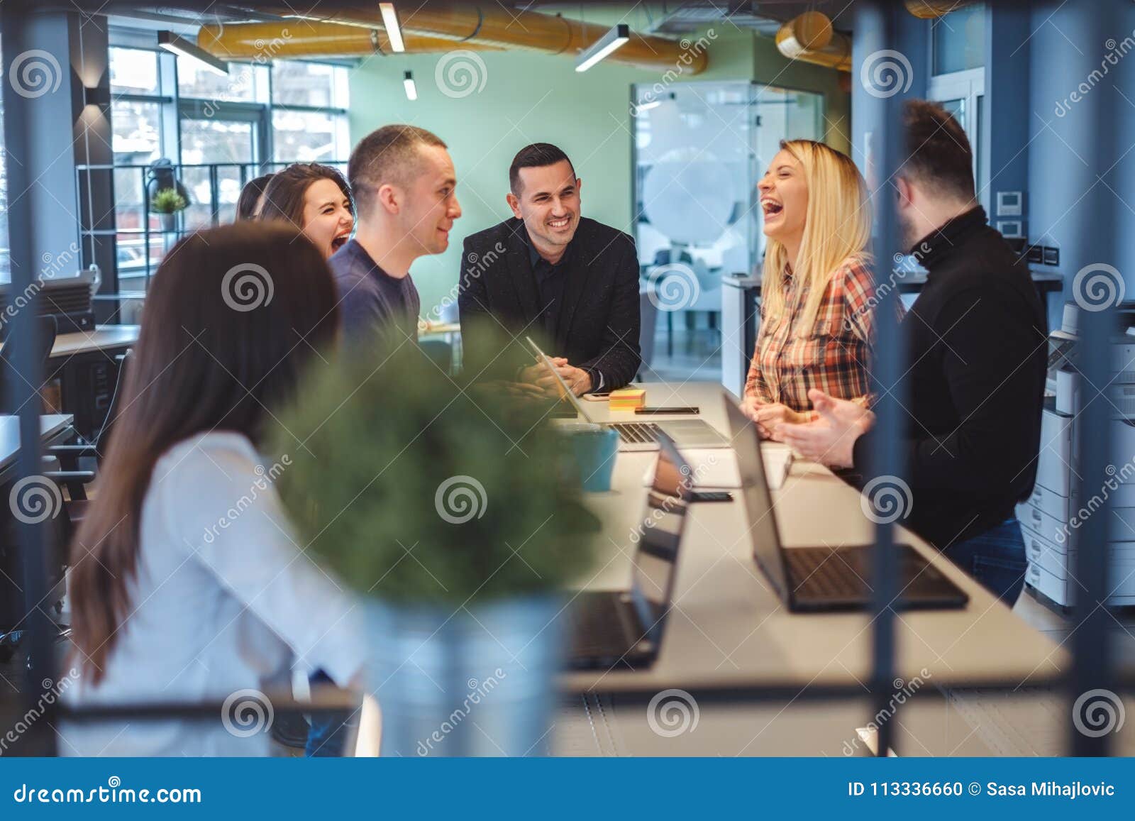 Coworkers Laughing at the Office Meeting Stock Photo - Image of ...