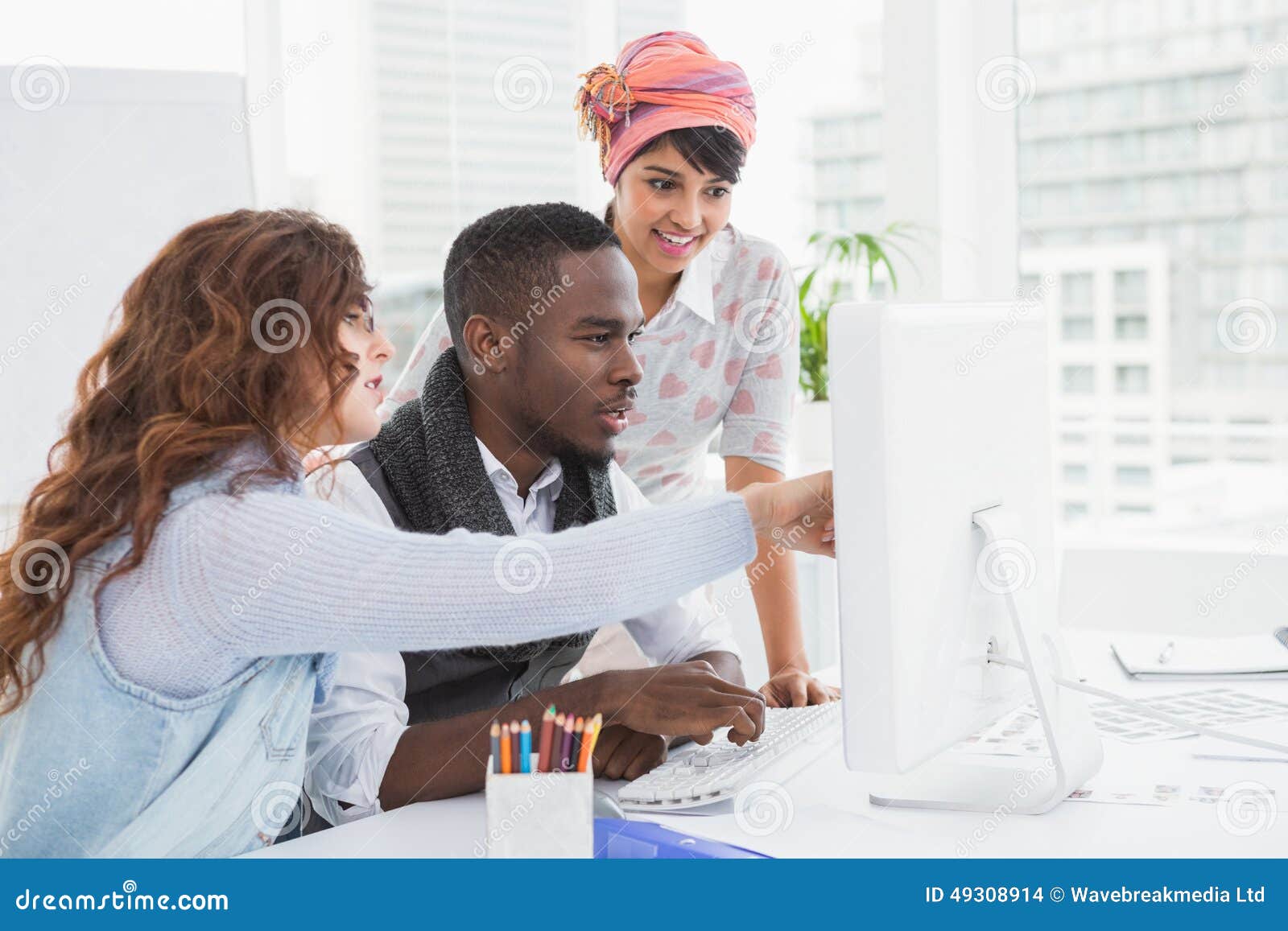 Coworkers Pointing Computer and Interacting Stock Photo - Image of ...