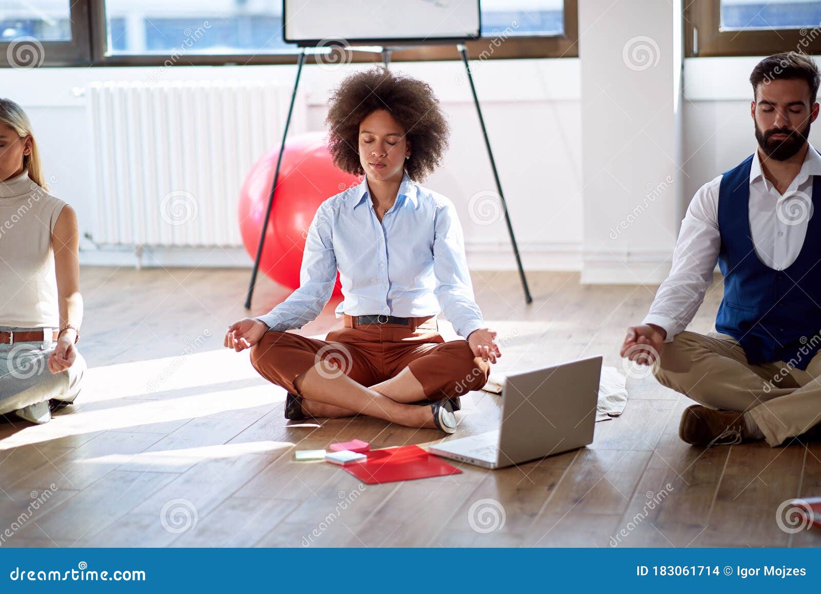 Coworkers Practicing Meditation at Work. Coworkers Sitting on the Floor ...