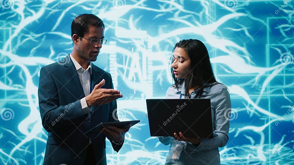 Coworkers Solving Tasks on Laptop and Tablet, Running AI Software Stock Image - Image of ...