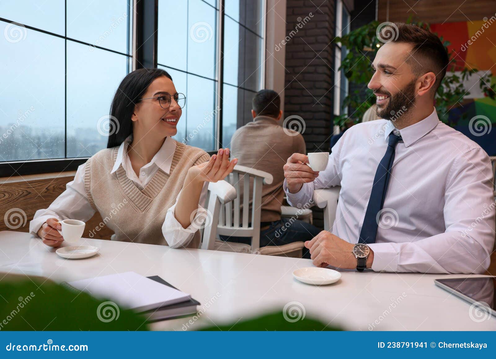 Coworkers Talking in Cafe during Coffee Break Stock Image - Image of ...