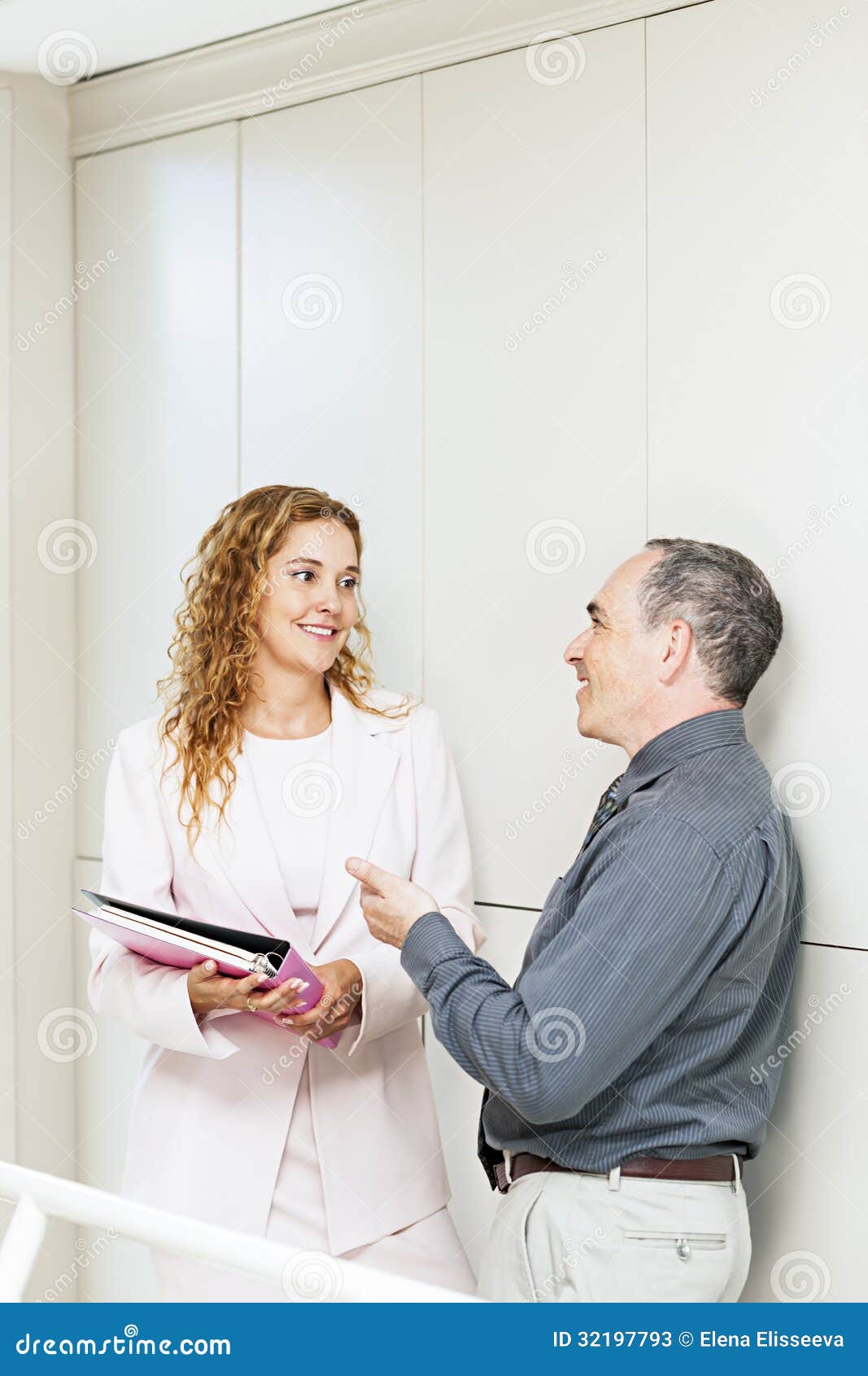 Coworkers Talking in Hallway Stock Image - Image of meet, office: 32197793