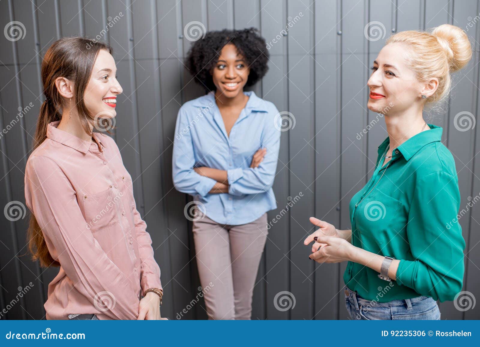 Coworkers talking indoors stock photo. Image of african - 92235306