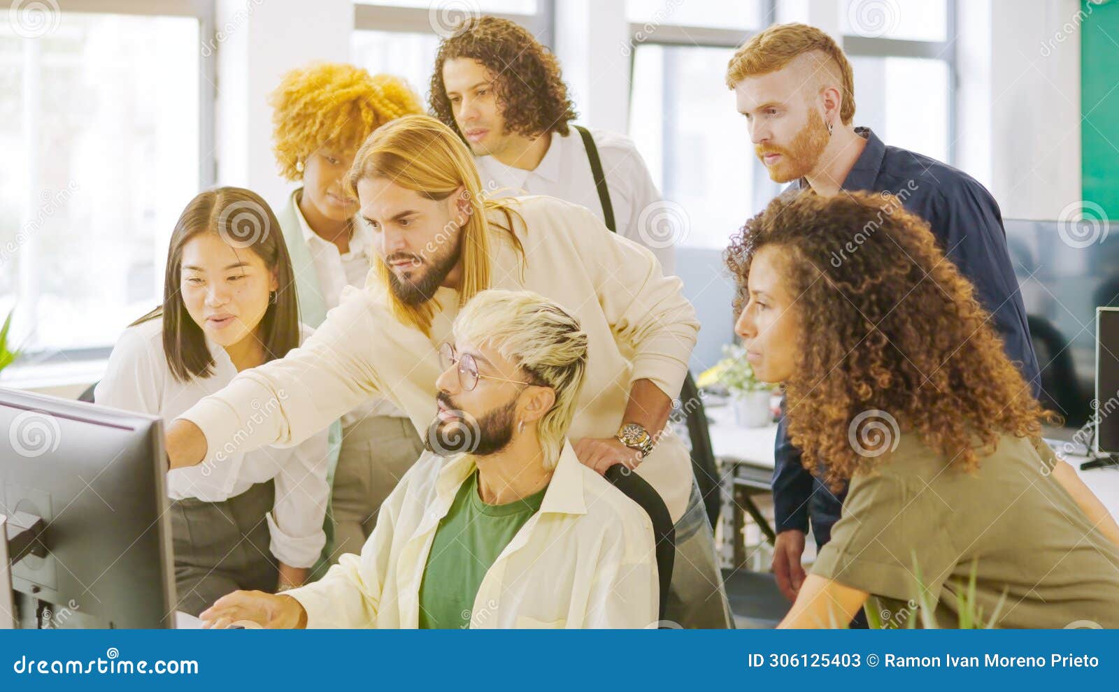 Coworkers Talking while Looking at a One Computer Screen Stock Image ...