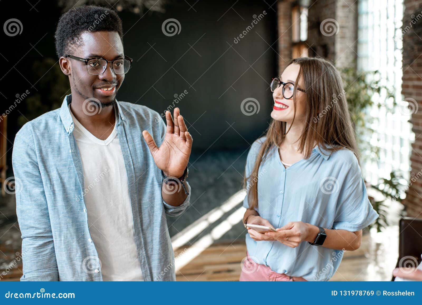 Coworkers Talking Together at the Office Stock Image - Image of ...