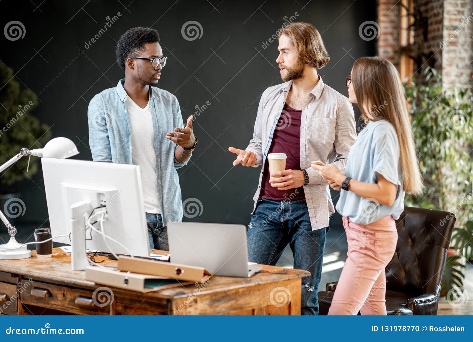 Coworkers Talking Together at the Office Stock Photo - Image of adult ...