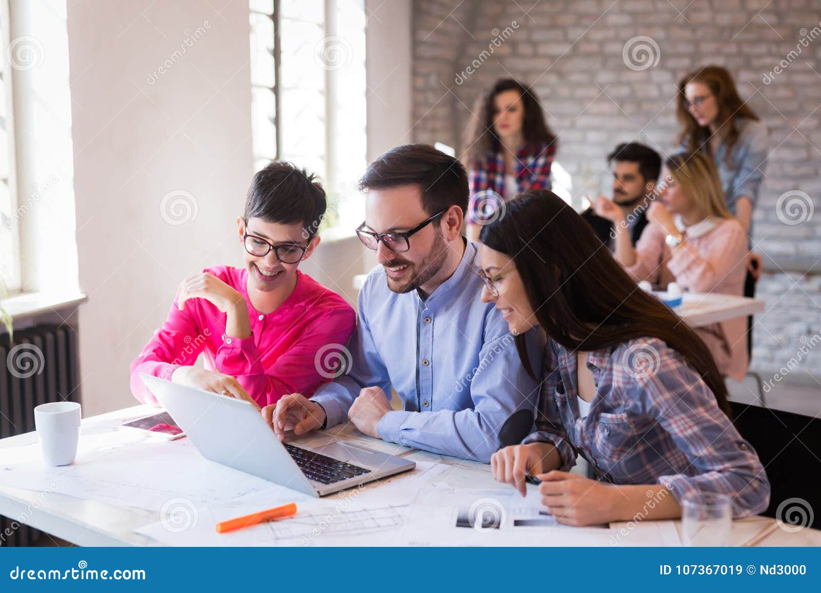 Coworkers Working on Project Together in Office Stock Image - Image of ...