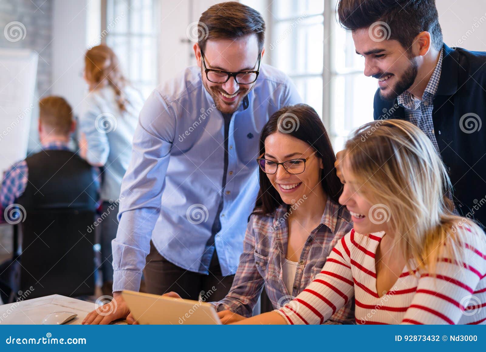 Coworkers Working on Project Together in Office Stock Photo - Image of ...