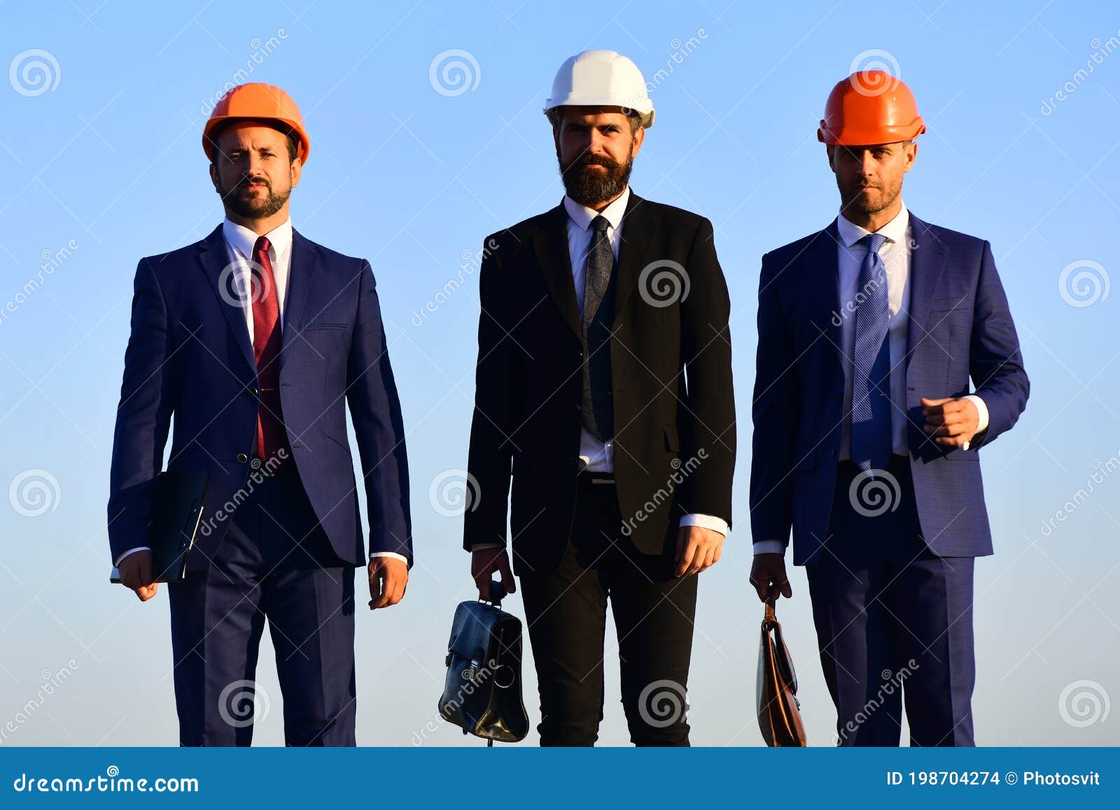 Coworking and Construction Business Concept. Workers and Engineer Hold ...
