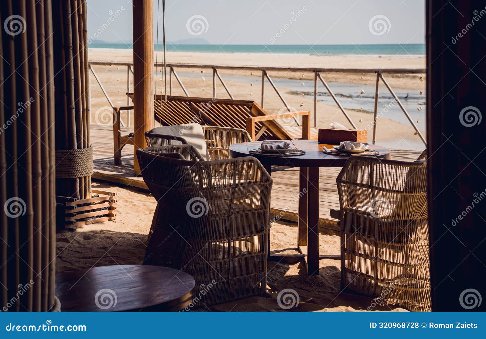 A Cozy Beach Cafe with Couch and Rustic Chairs Stock Photo - Image of ...