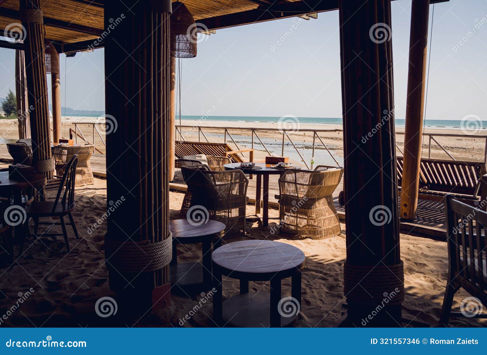A Cozy Beach Cafe with Couch and Rustic Chairs Stock Photo - Image of ...