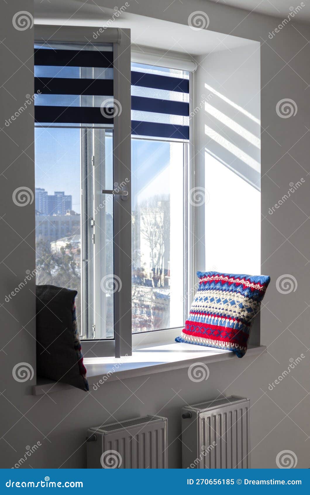 Cozy Concept. Window with Blue Blinds and Colorful Pillows on the ...