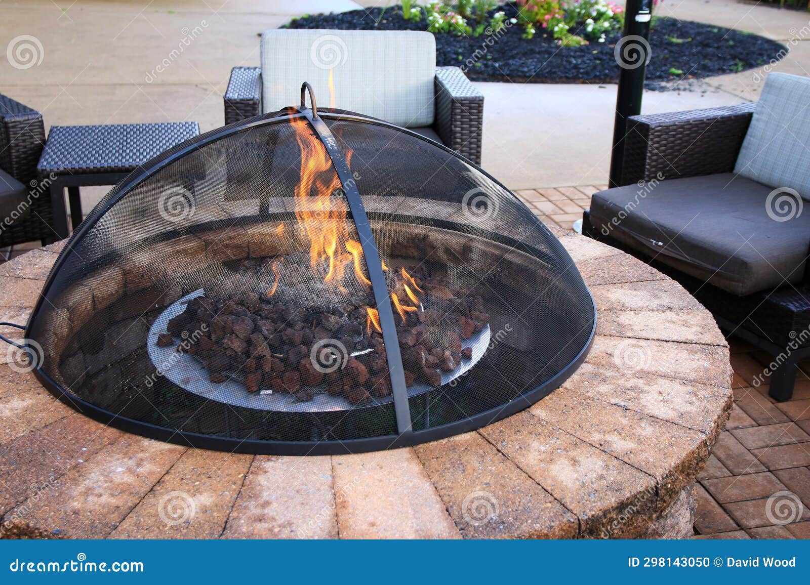 A Cozy Evening by the Fire: a Fire Pit Illuminates a Brick Patio Stock ...