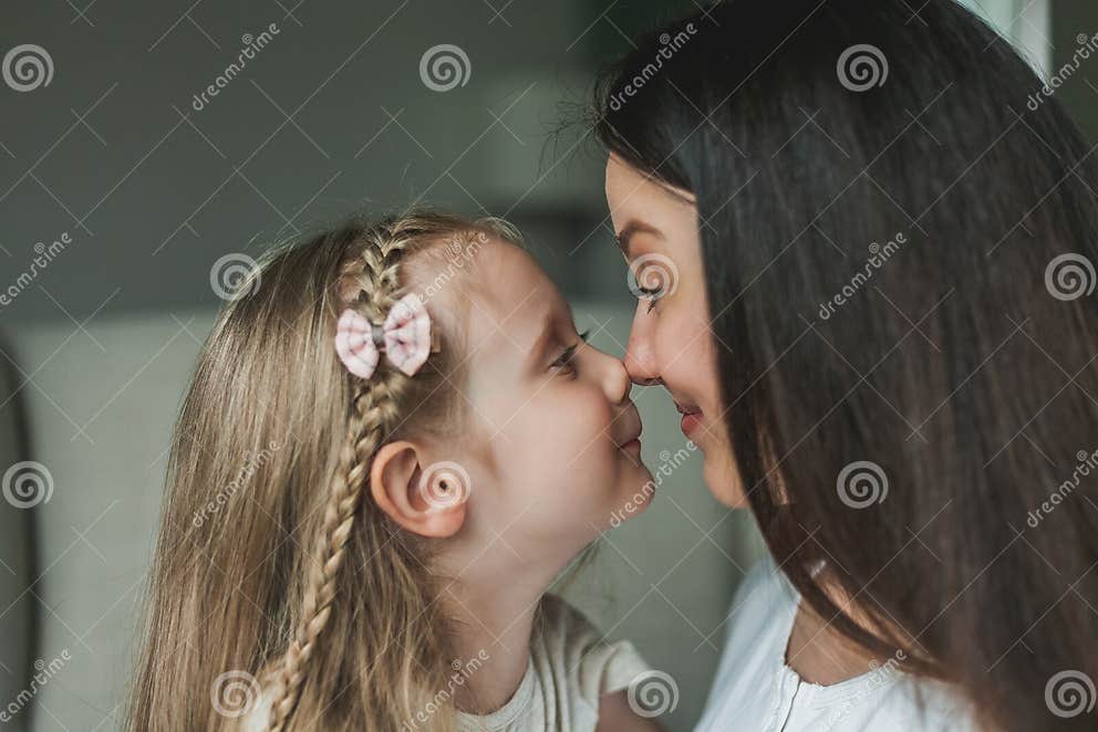 Cozy Home Portrait Of A Young Beautiful Dark Haired Mother And Her 4