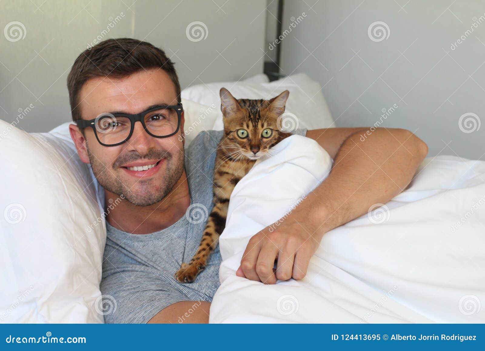 Cozy Man in Bed with His Pet Stock Image - Image of feline, bengal ...