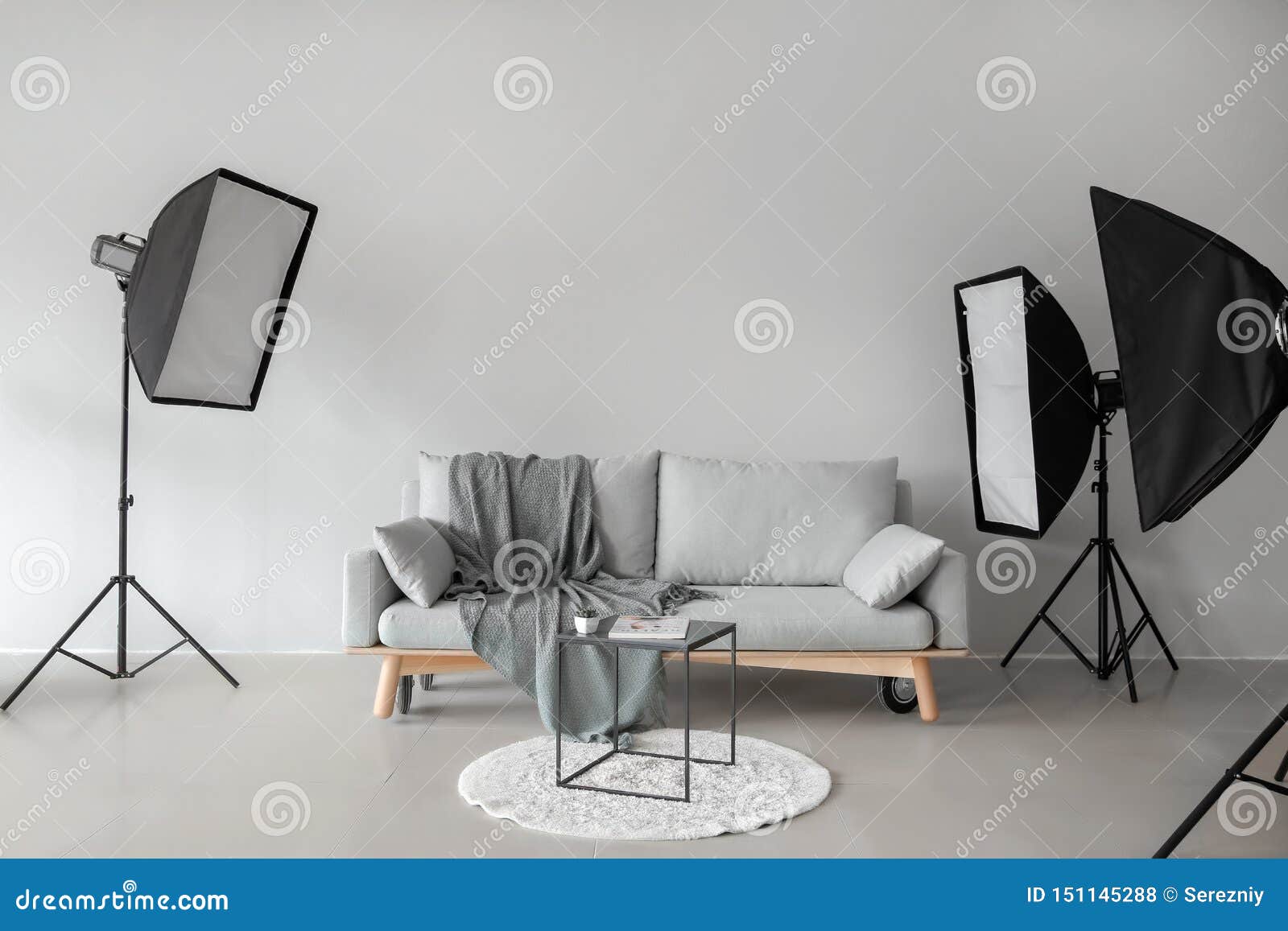 Cozy Sofa and Table in Photo Studio with Professional Equipment Stock ...
