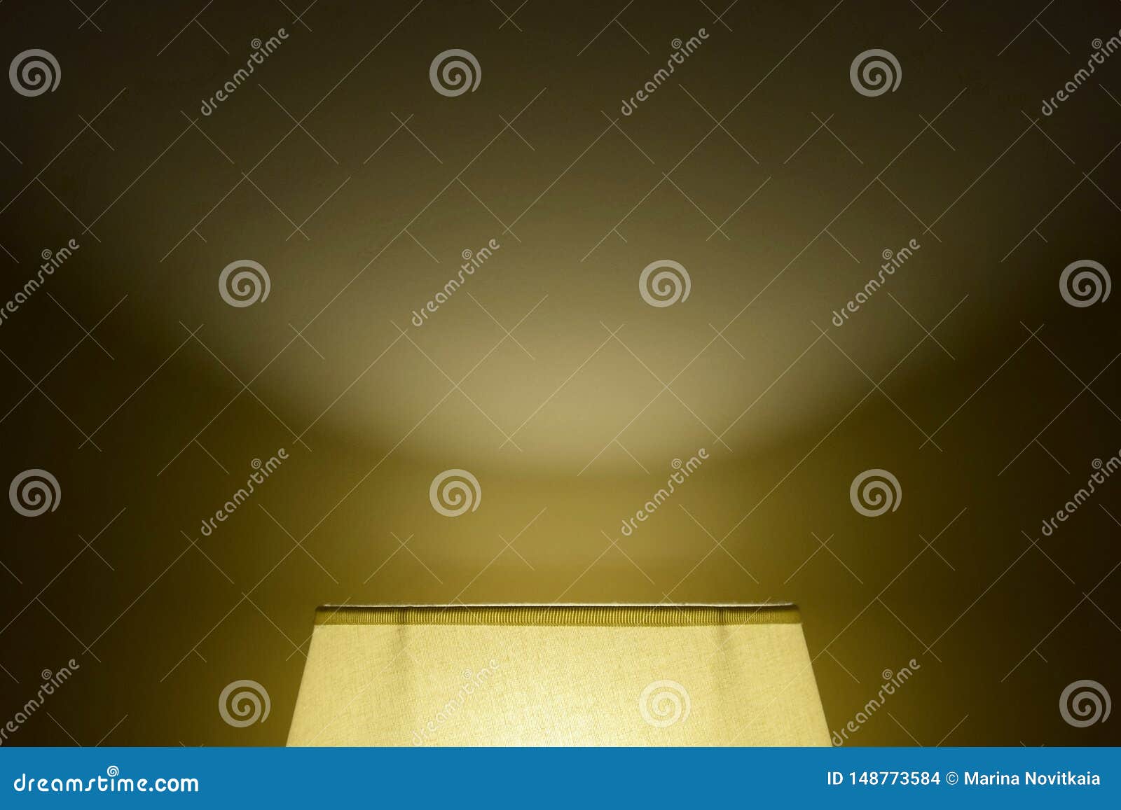 A Cozy Soft Light from a Lamp Shade on the Wall in a Dark Room ...