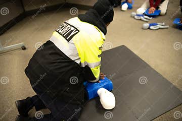 CPR Training Class by Security Guard in Office Stock Photo - Image of ...