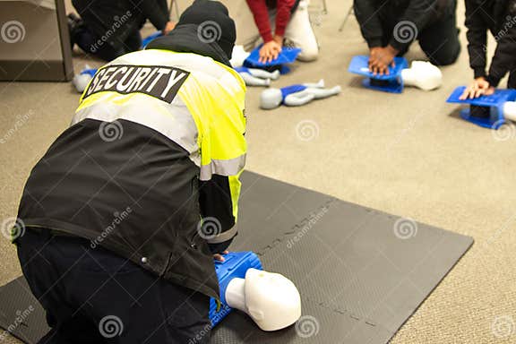 CPR Training Class by Security Guard in Office Stock Image - Image of ...
