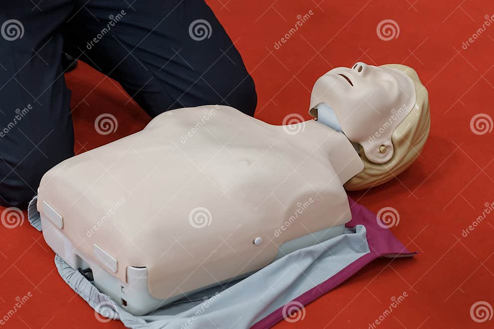 CPR Training Manikin on Red Mat Stock Photo - Image of response ...