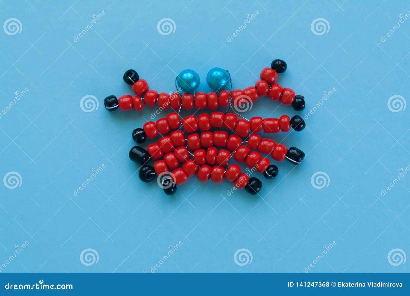 Crab Made of Beads, Children`s Crafts on a Blue Background Stock Photo ...
