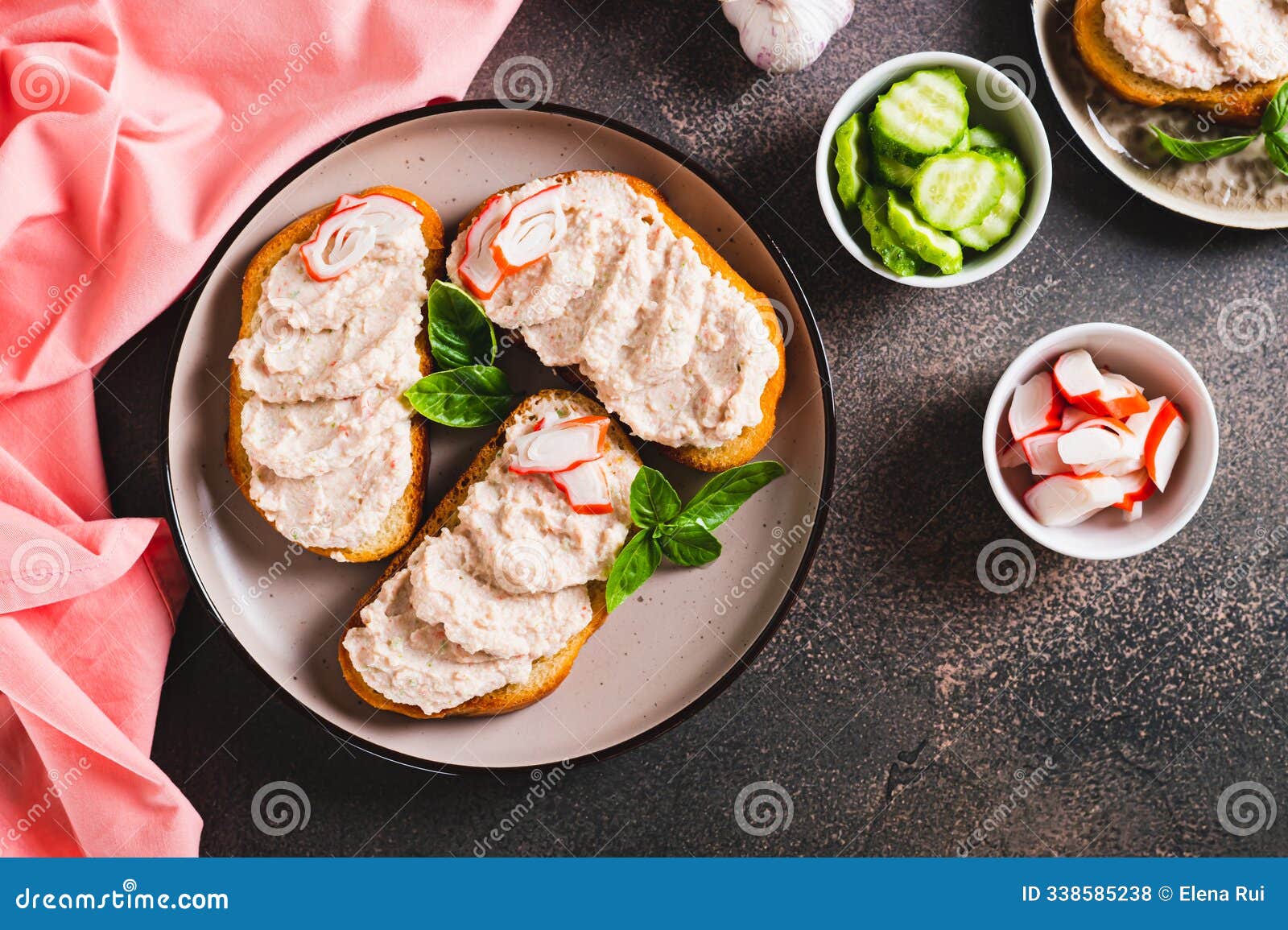 Crab Stick and Cucumber Pate on Toast on a Plate on the Table Top View ...