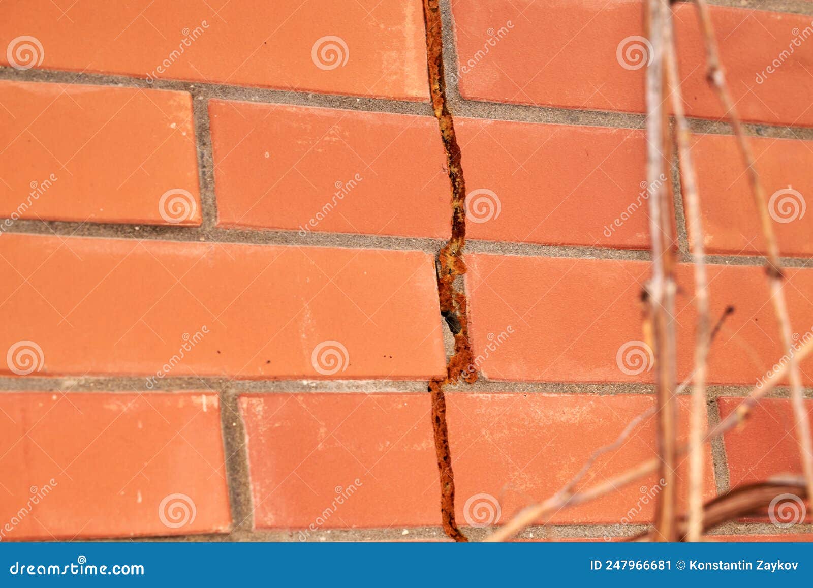 Crack in the Brick Wall of the House with the Remnants of the Mounting ...