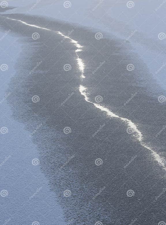 Crack in the thin ice. stock photo. Image of lake, crack - 80345702