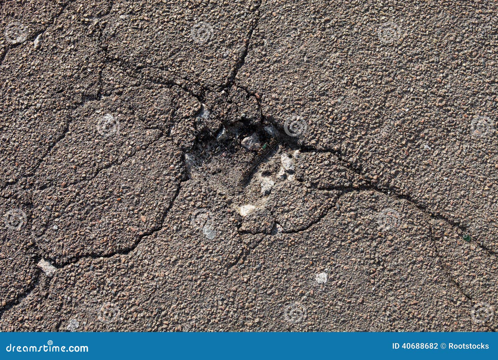 Cracked Asphalt Surface with a Small Pit Stock Photo - Image of ...