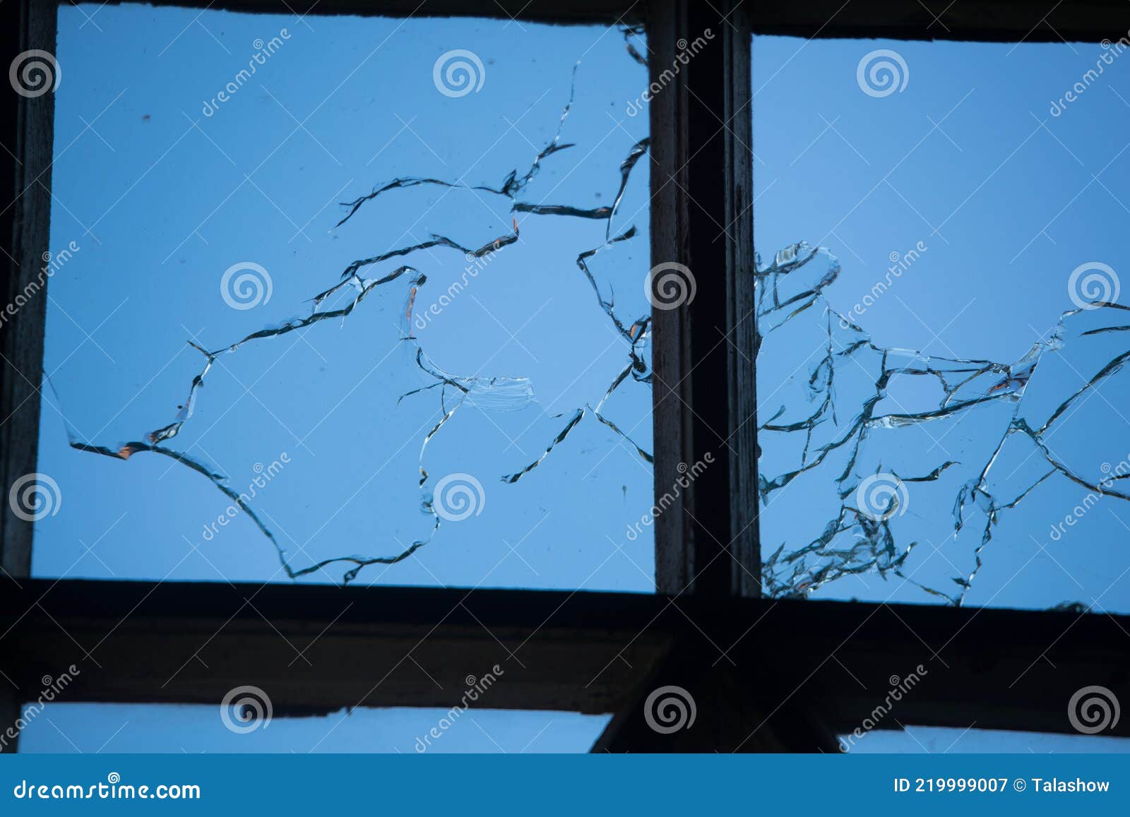 Cracked and Broken Window Glass Punched by a Pistol Bullet Stock Image ...