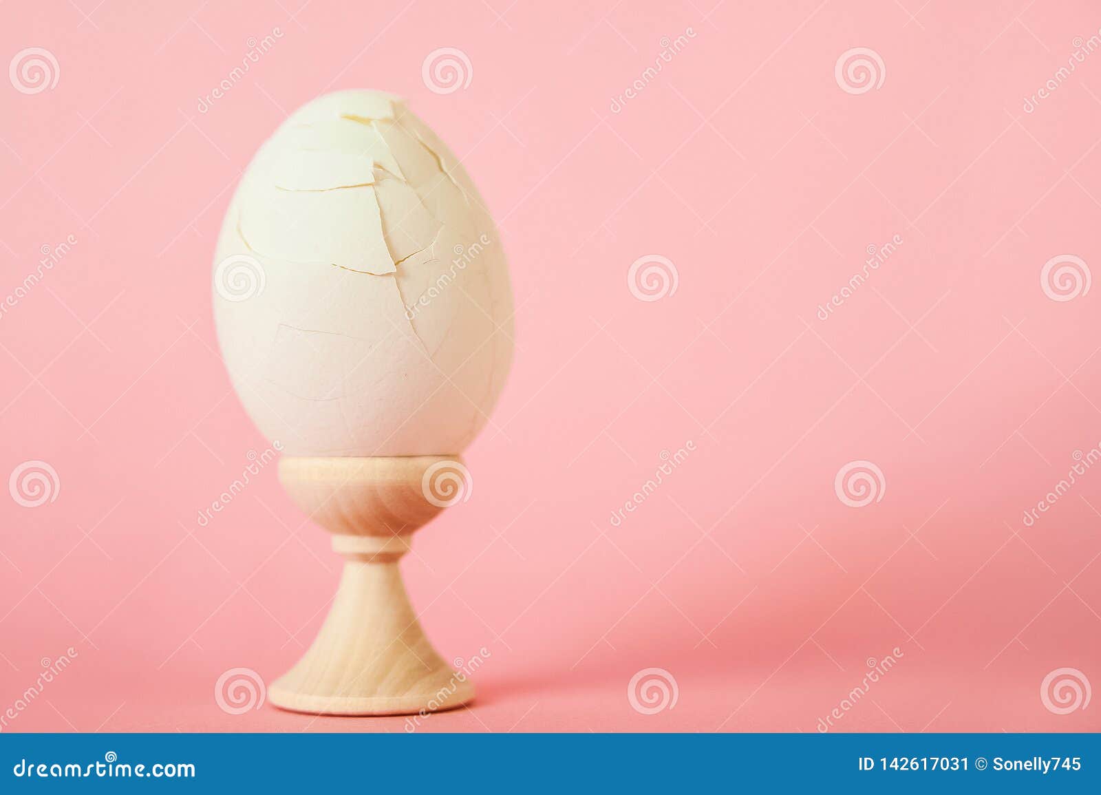 A Cracked Egg on a Pink Background Close-up and Copy Space. One Egg ...