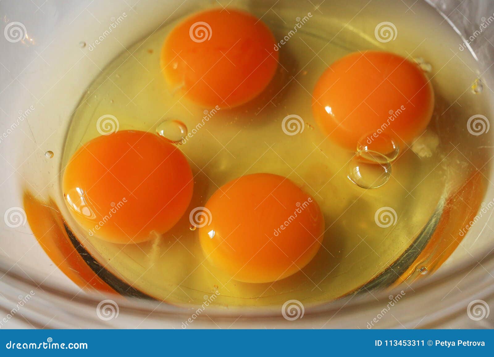 Cracked Eggs in a Glass Mixing Bowl Stock Image - Image of mixing ...