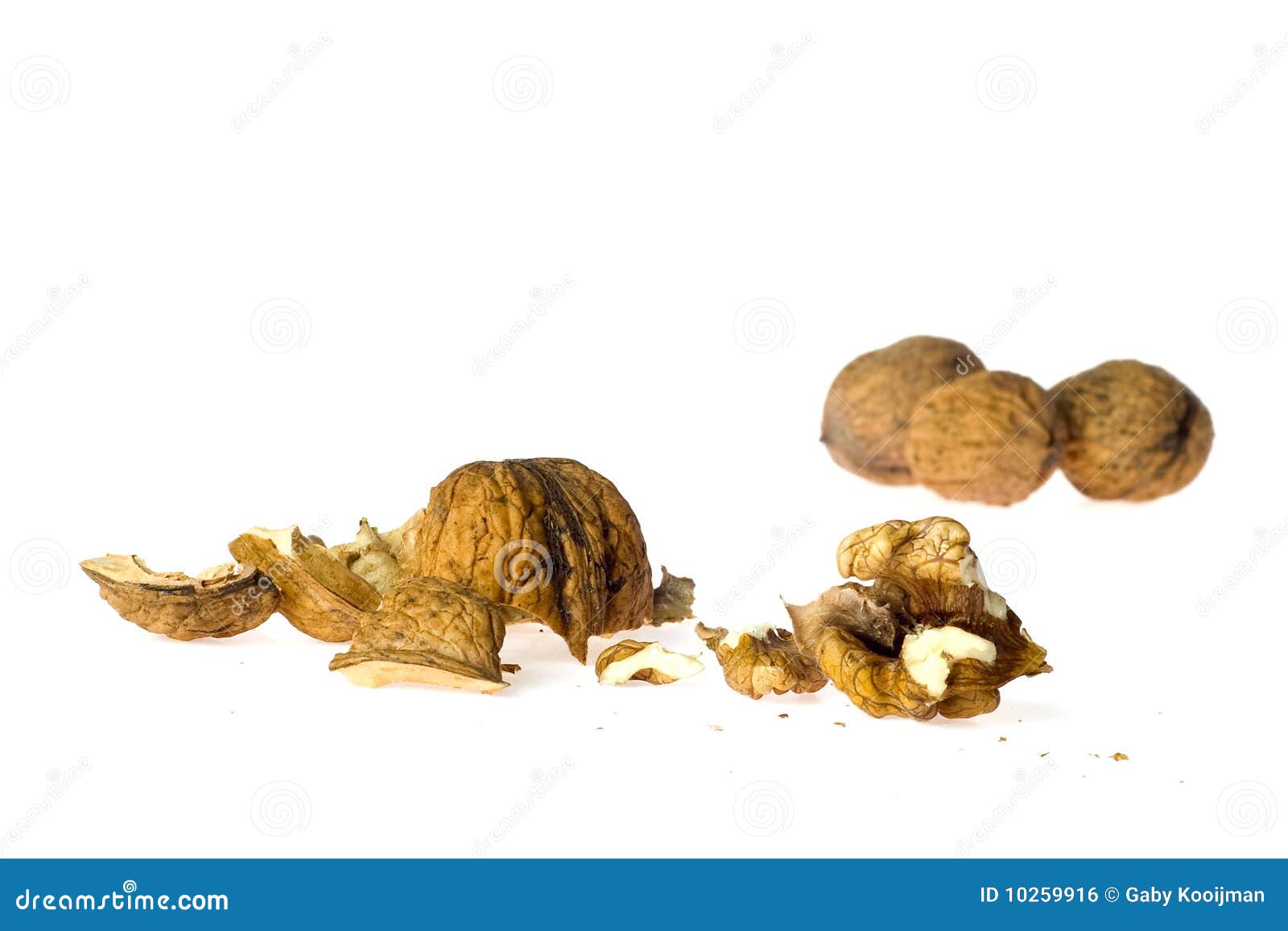 Cracked Walnut Shells With One Complete Walnut In The Middle. Pieces Of ...
