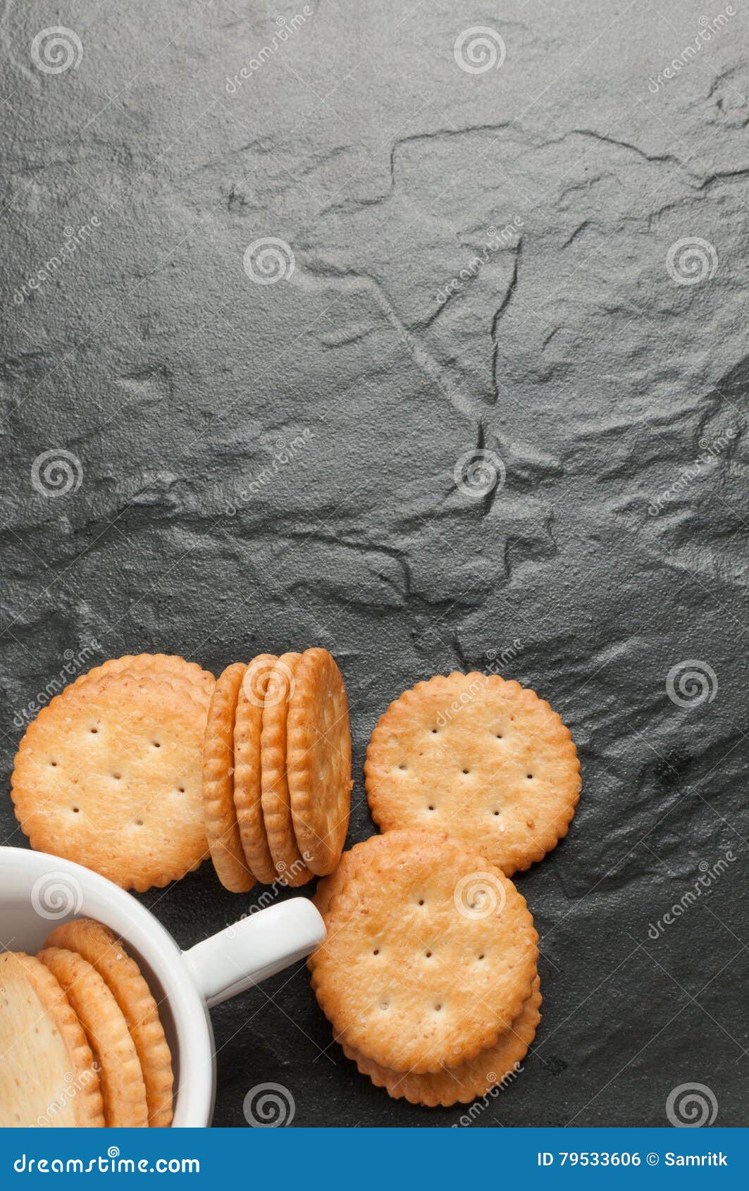 Cracker Stacked in White Cup of Coffee Over Black Granite Stock Photo ...