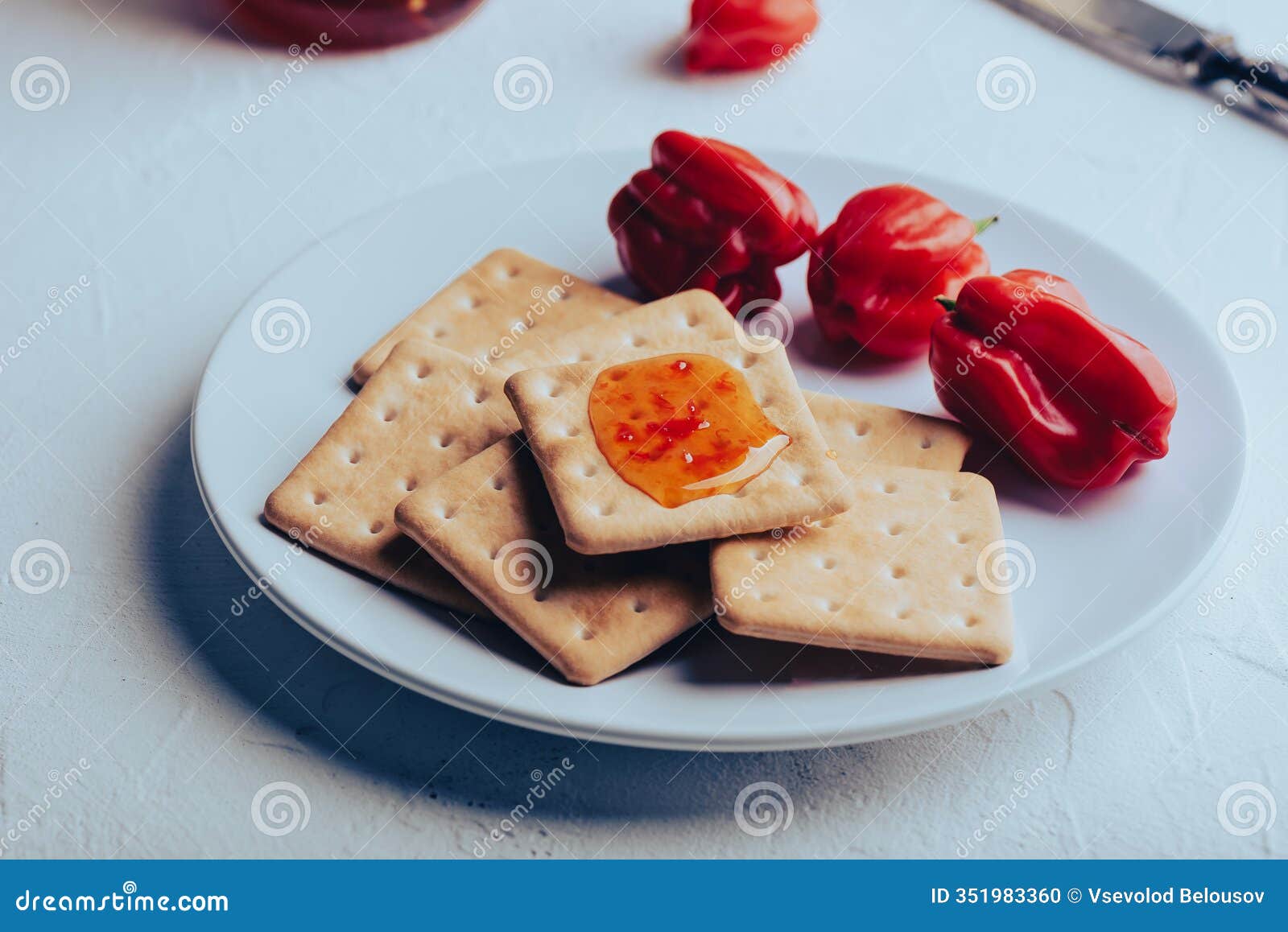 Crackers with Chili Pepper Jelly Stock Photo - Image of wheat, sauce ...