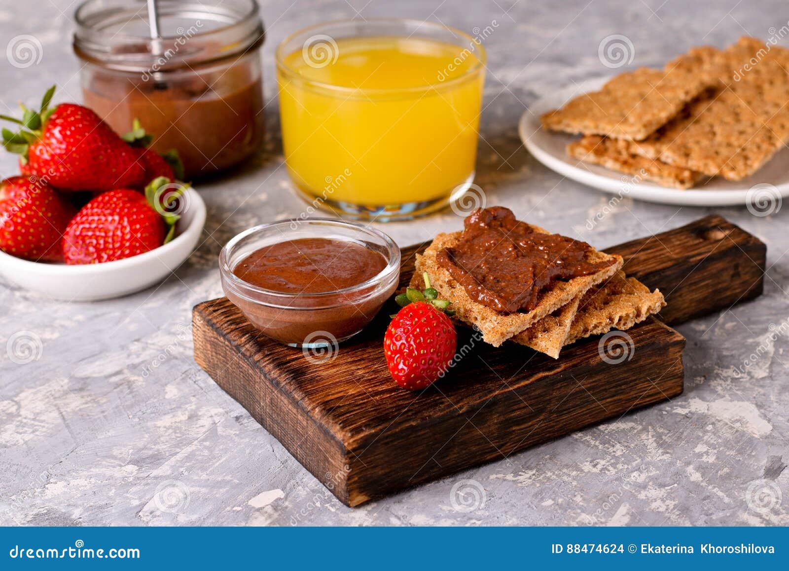 Crackers Spread with Chocolate Hazelnut Filling and Strawberries Stock ...