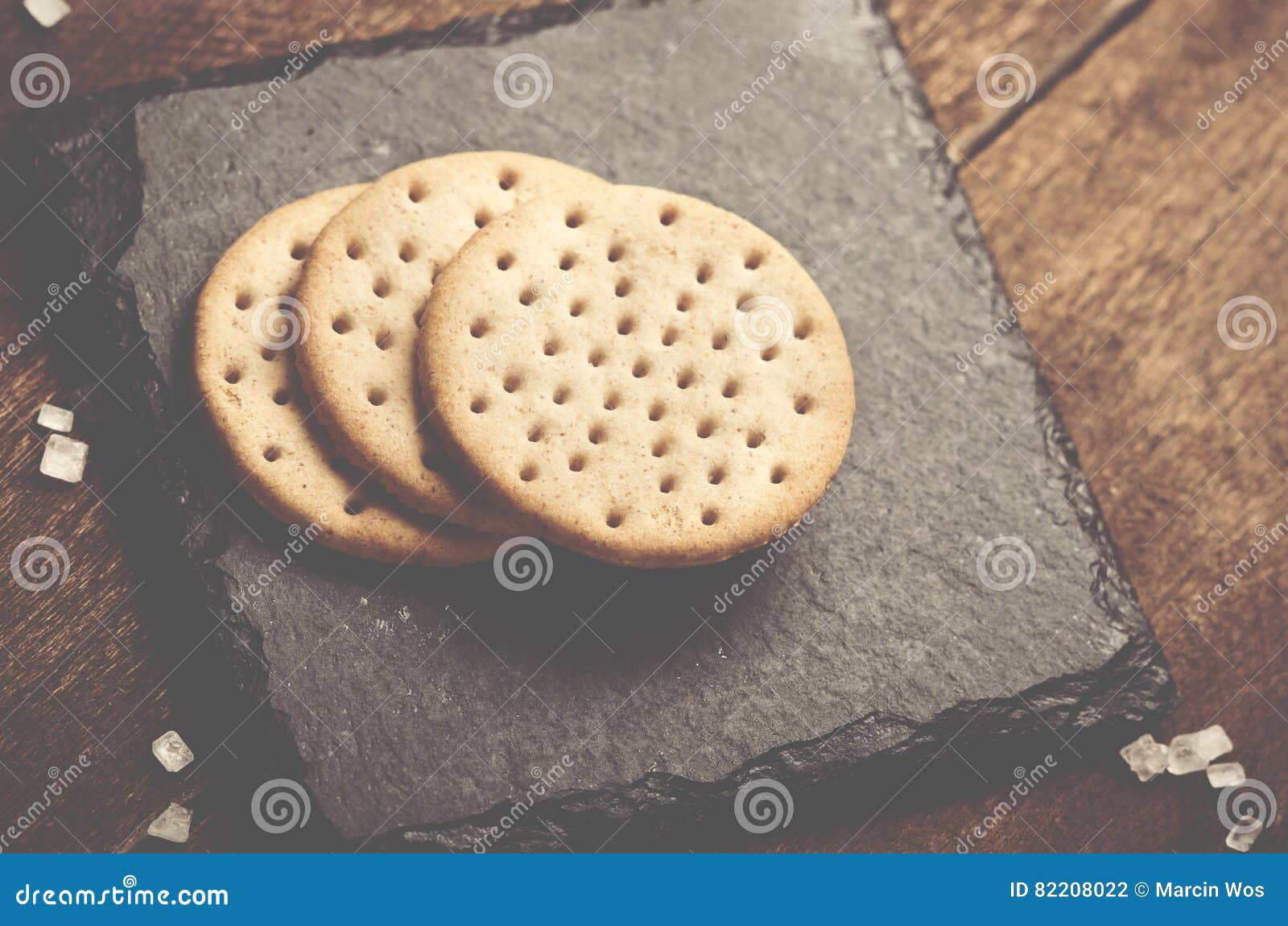 Crackers Stack Together on Black Stone, Coarse Sugar on Wooden B Stock ...