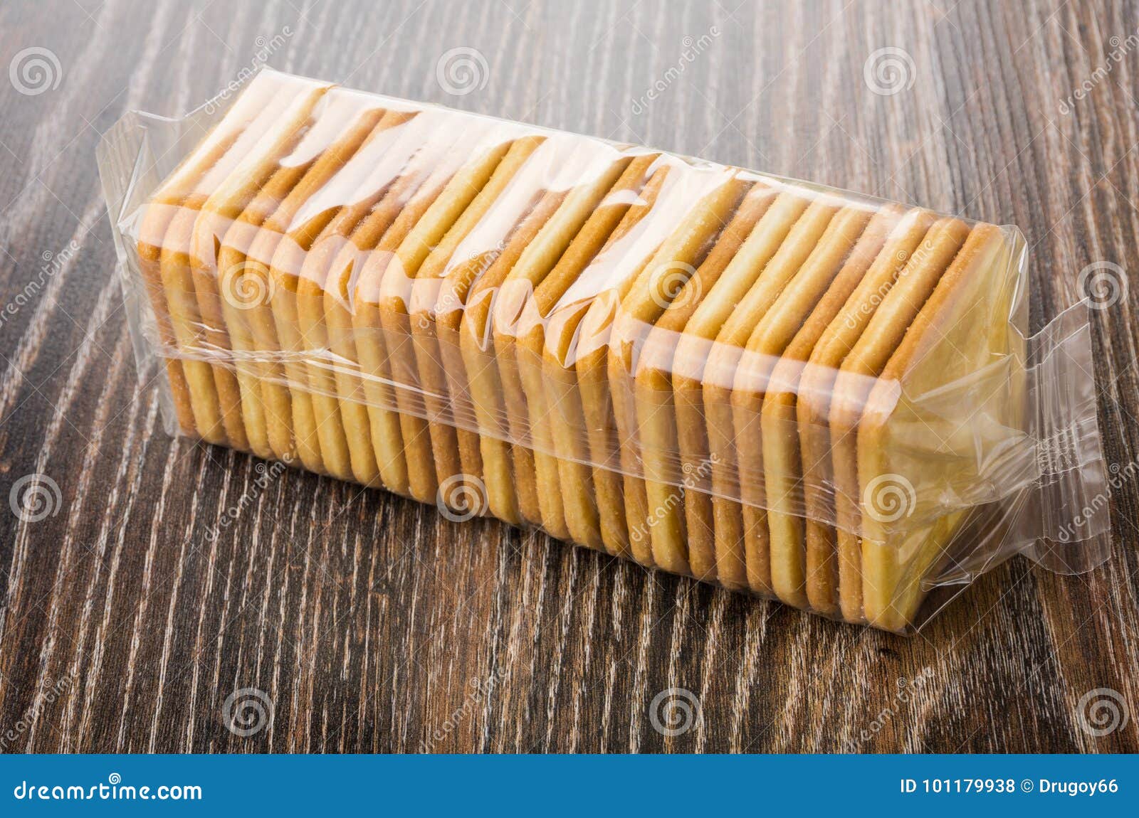 Crackers in Transparent Wrapper on Wooden Table Stock Photo - Image of ...