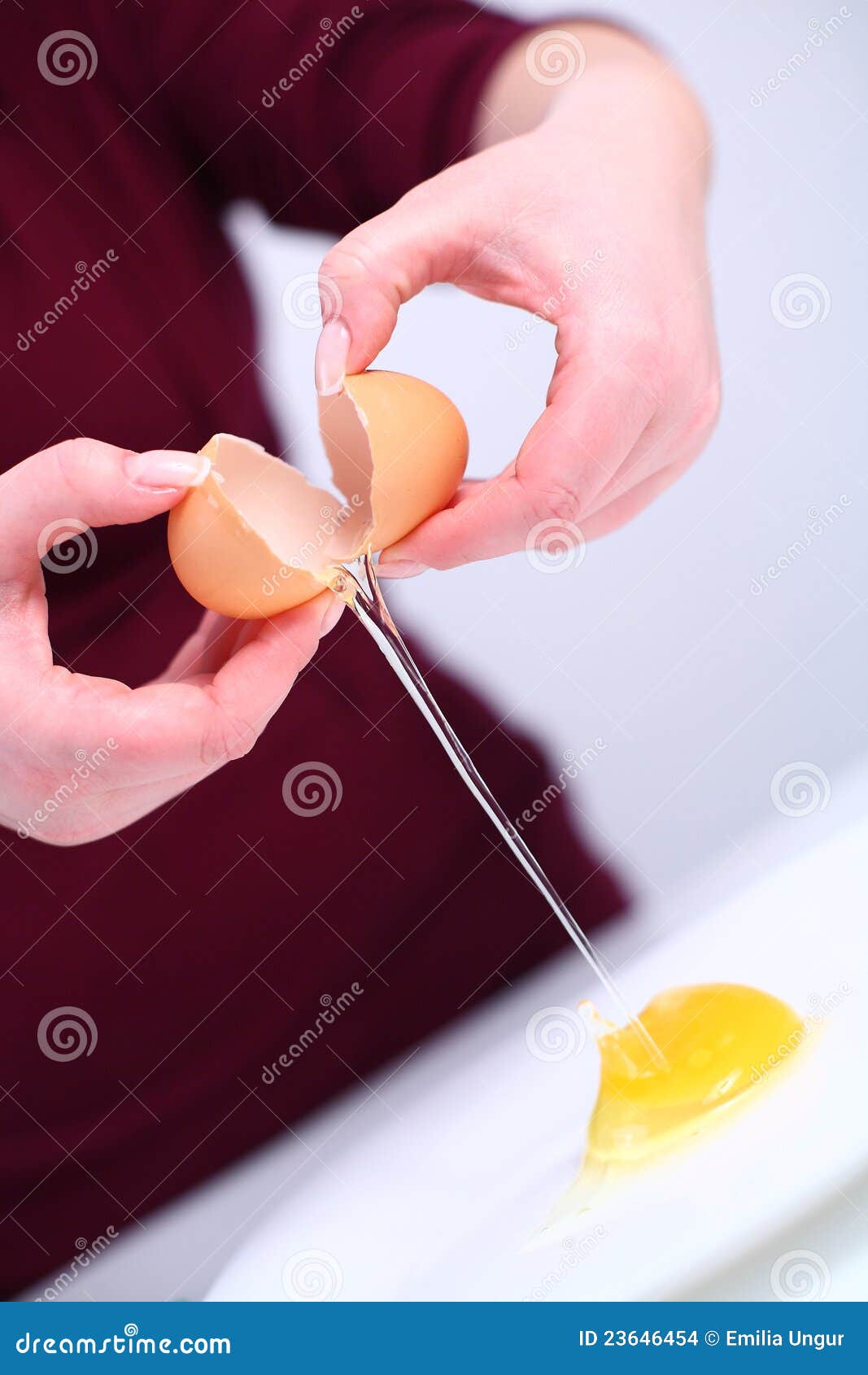 Cracking an egg stock photo. Image of cooking, ingredient - 23646454