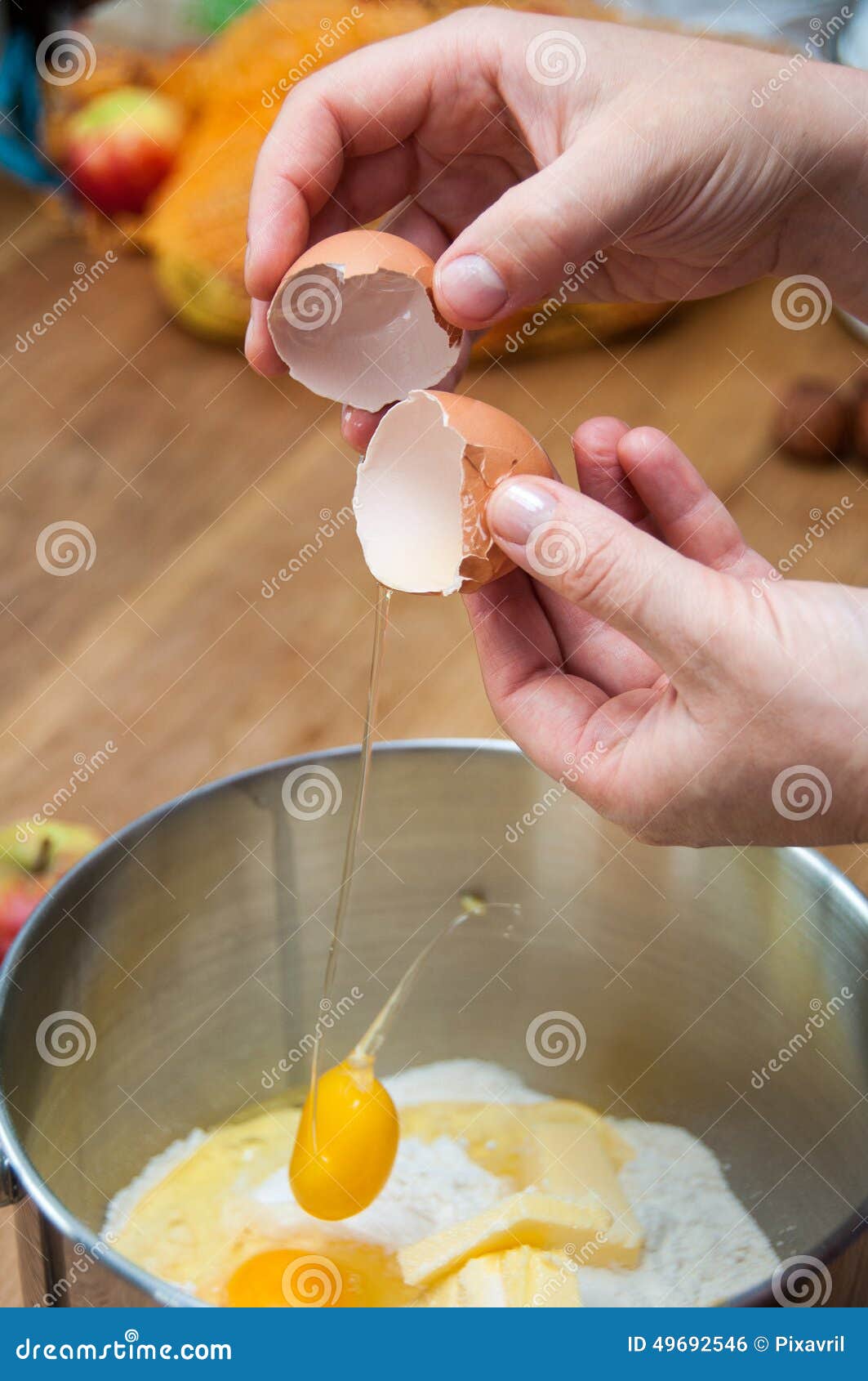 Cracking an egg stock photo. Image of homemade, yolk - 49692546