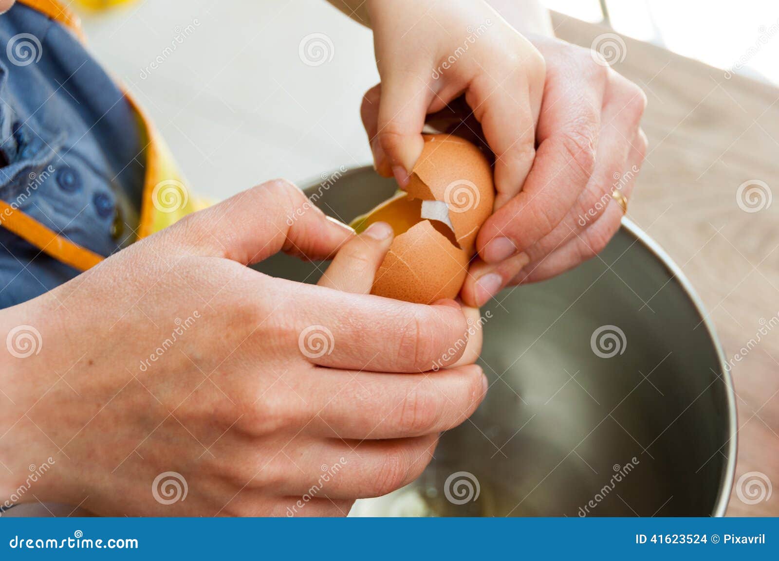 Cracking an egg stock photo. Image of recipe, eggshell - 41623524