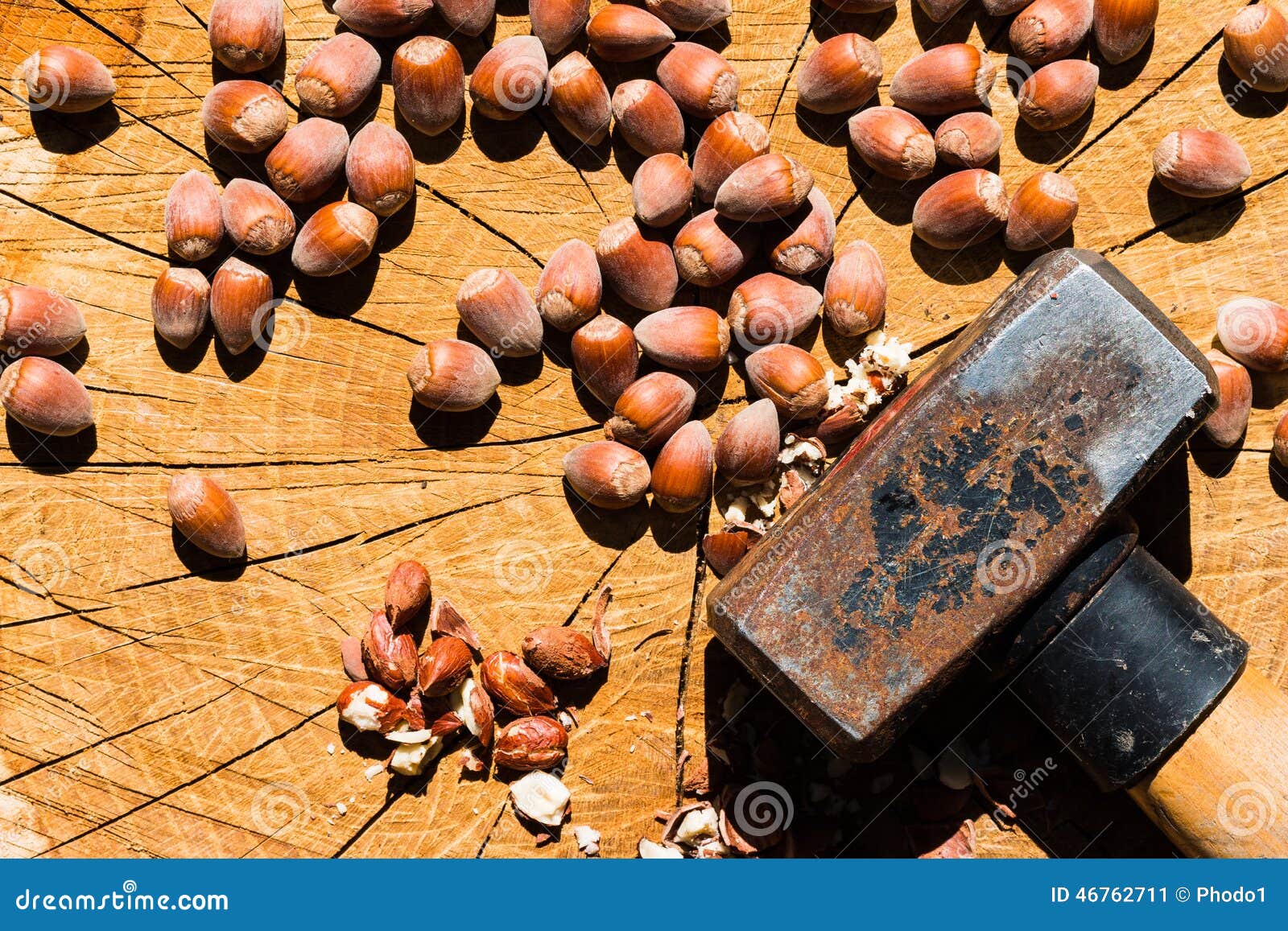 Cracking nuts with hammer stock image. Image of broke - 46762711